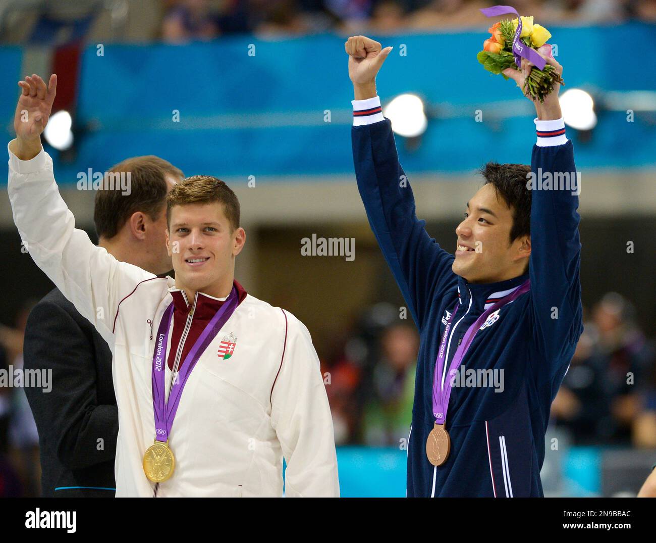 Hungary's Daniel Gyurta, left, and Japan's Ryo Tateishi pose with their ...