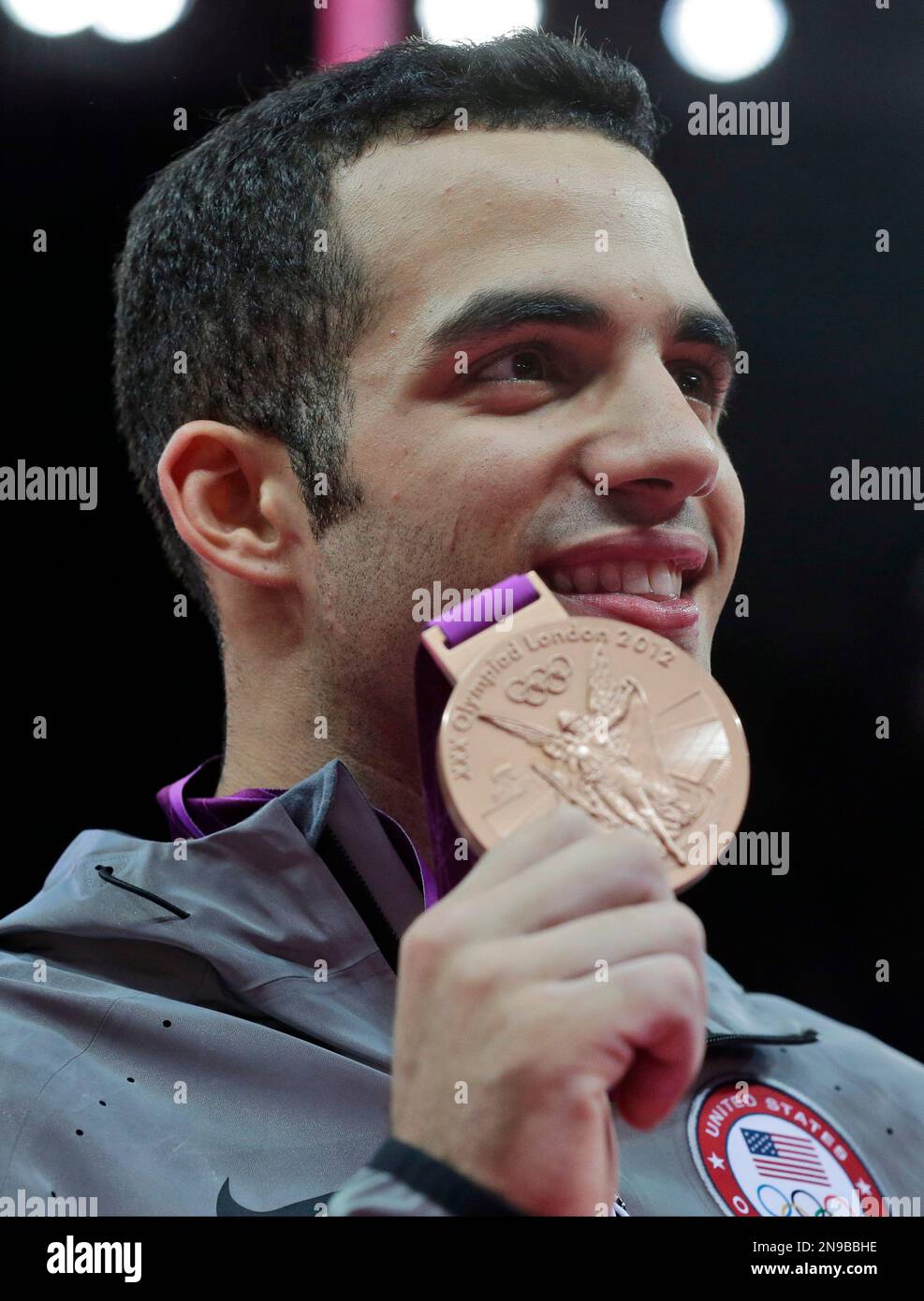 U.S. gymnast Danell Leyva displays his bronze medal during the medal ...