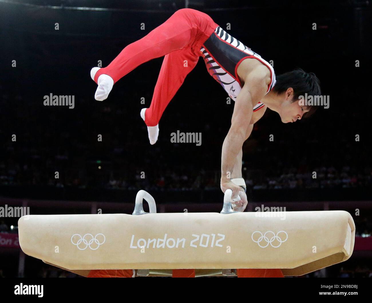 Japanese gymnast Kohei Uchimura performs on the pommel horse during the ...