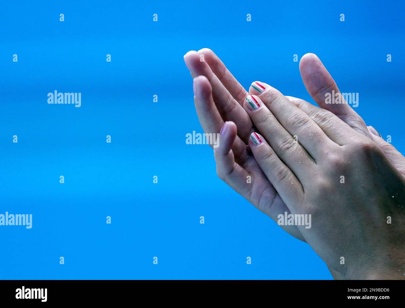 Dora Czigany of Hungary claps her hands as she watches her teammates ...