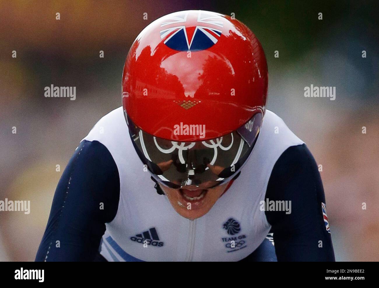 The Olympic rings are reflected in the helmet of Britain's Emma Pooley ...