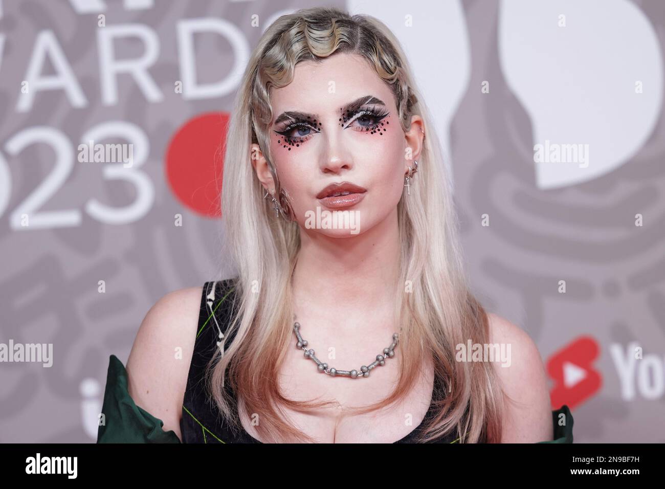 Abby Roberts poses for photographers upon arrival at the Brit Awards ...