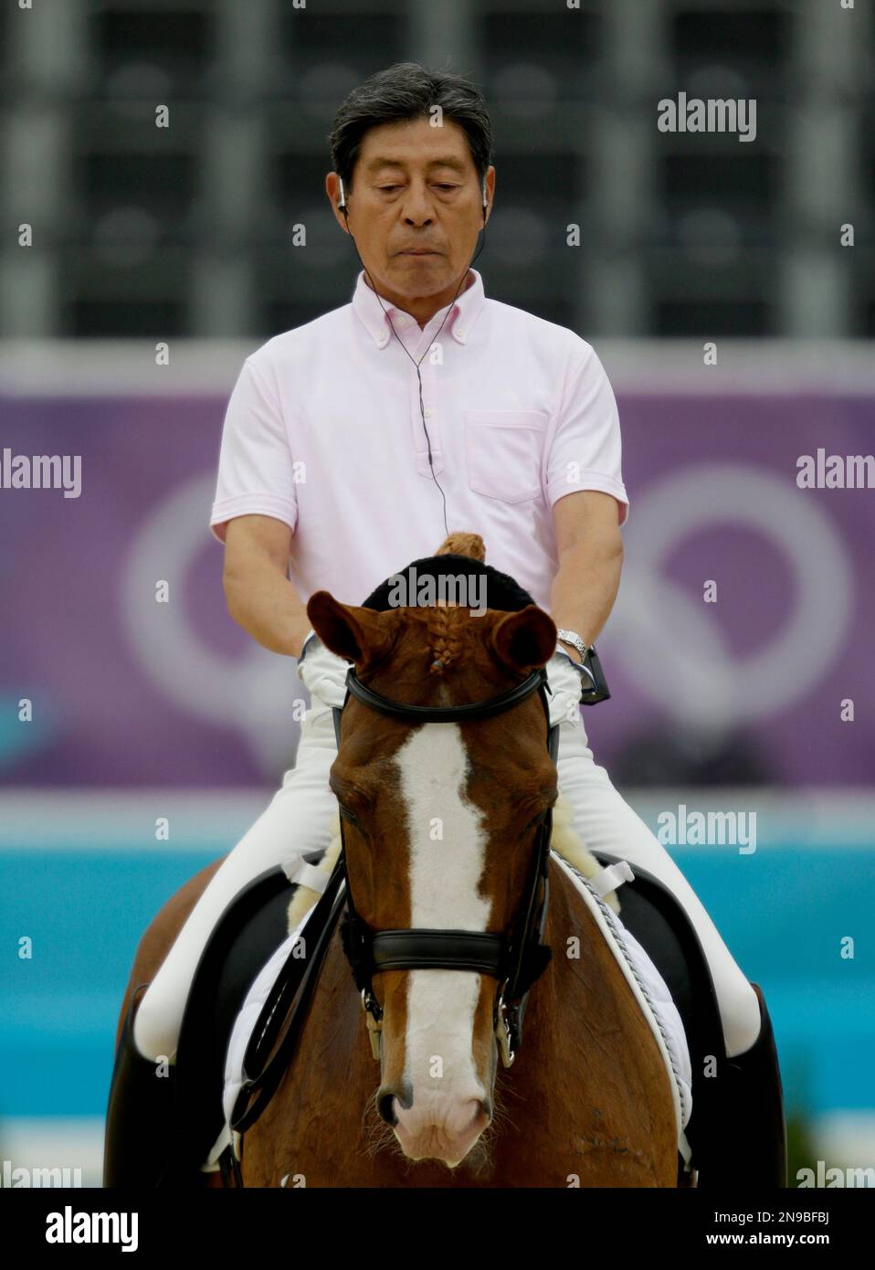 Hiroshi Hoketsu, of Japan, and his horse Whisper, train for the ...