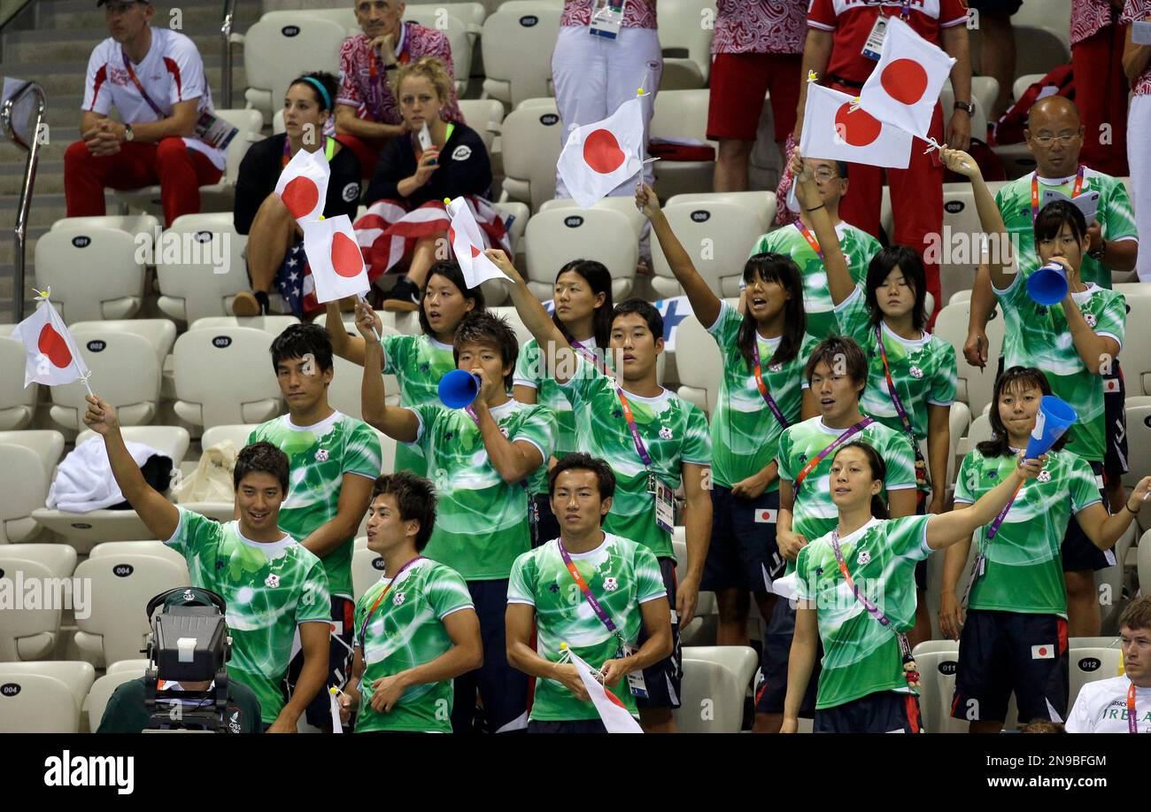 Japanese athletes cheer on their teammates in a women's 2 x 400-meter ...