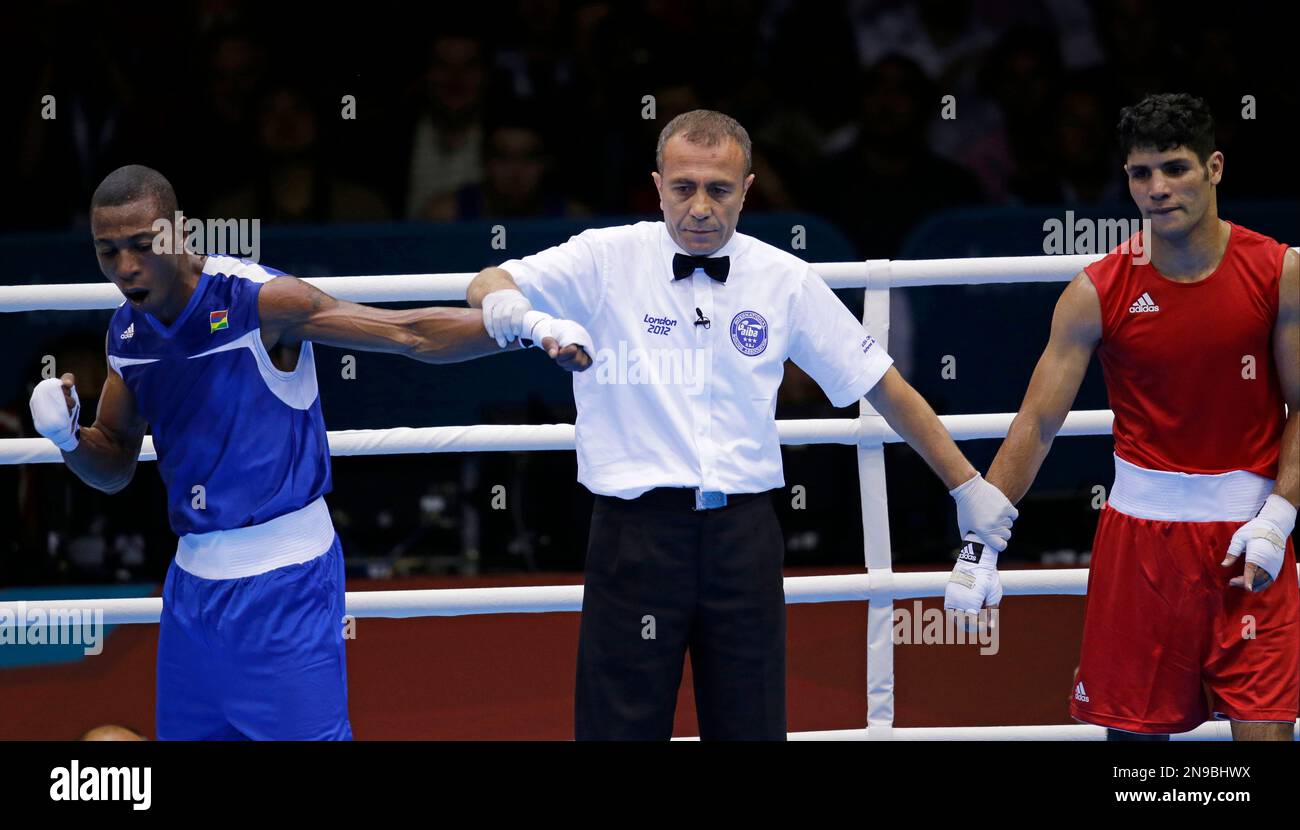 Mauritius' Richarno Colin, left, reacts after defeating Morocco's ...