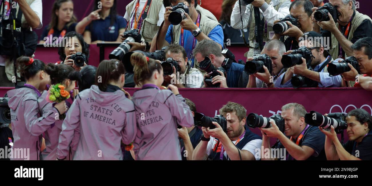 Photographers take pictures of U.S. gold medallist gymnasts after the ...