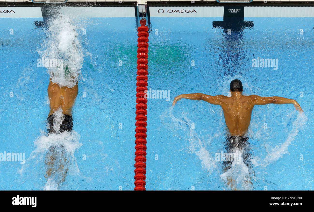 South Africa's Chad le Clos, left, touches ahead of Japan's Takeshi ...