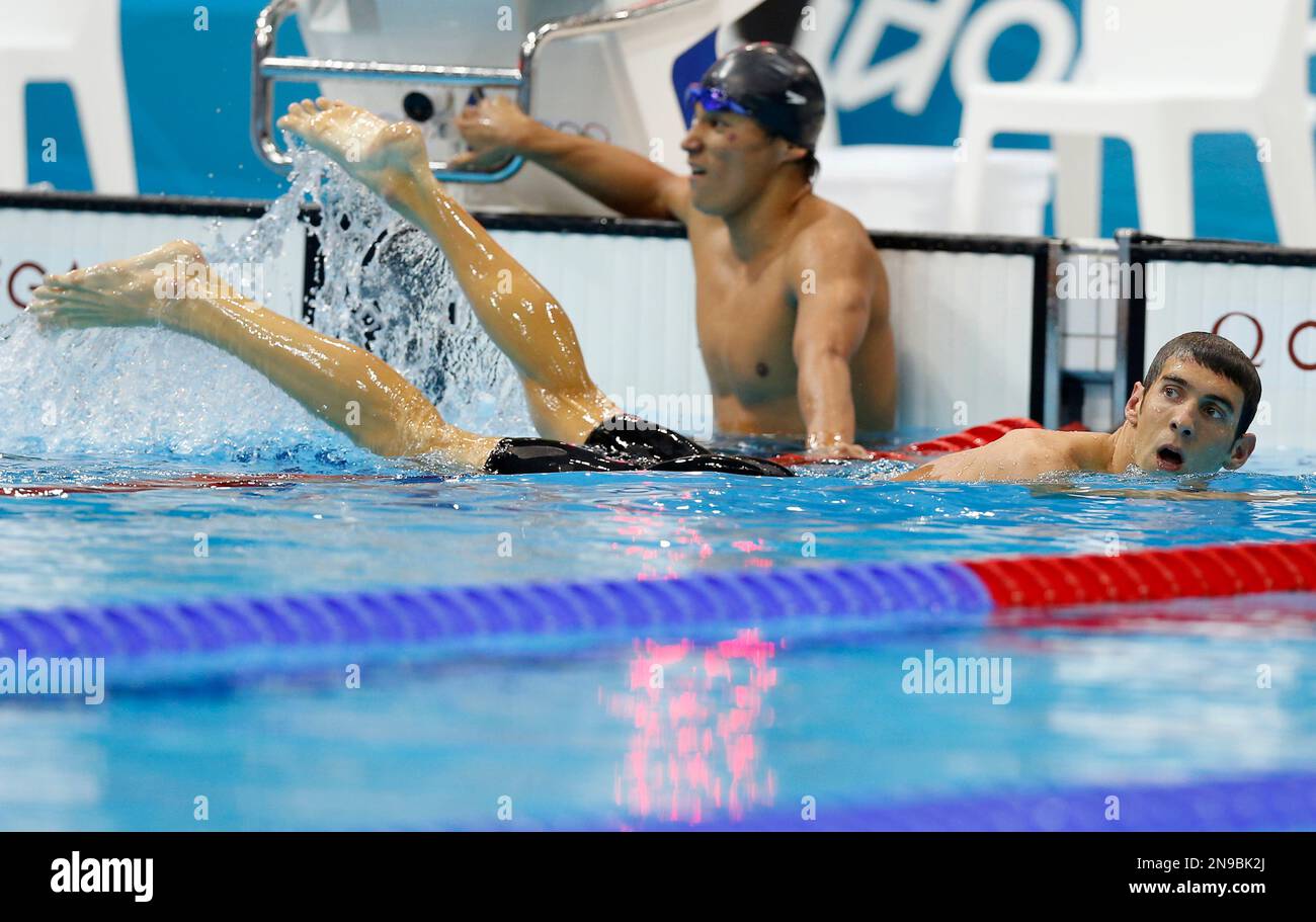 United States' Michael Phelps, right, and Japan's Takeshi Matsuda react ...
