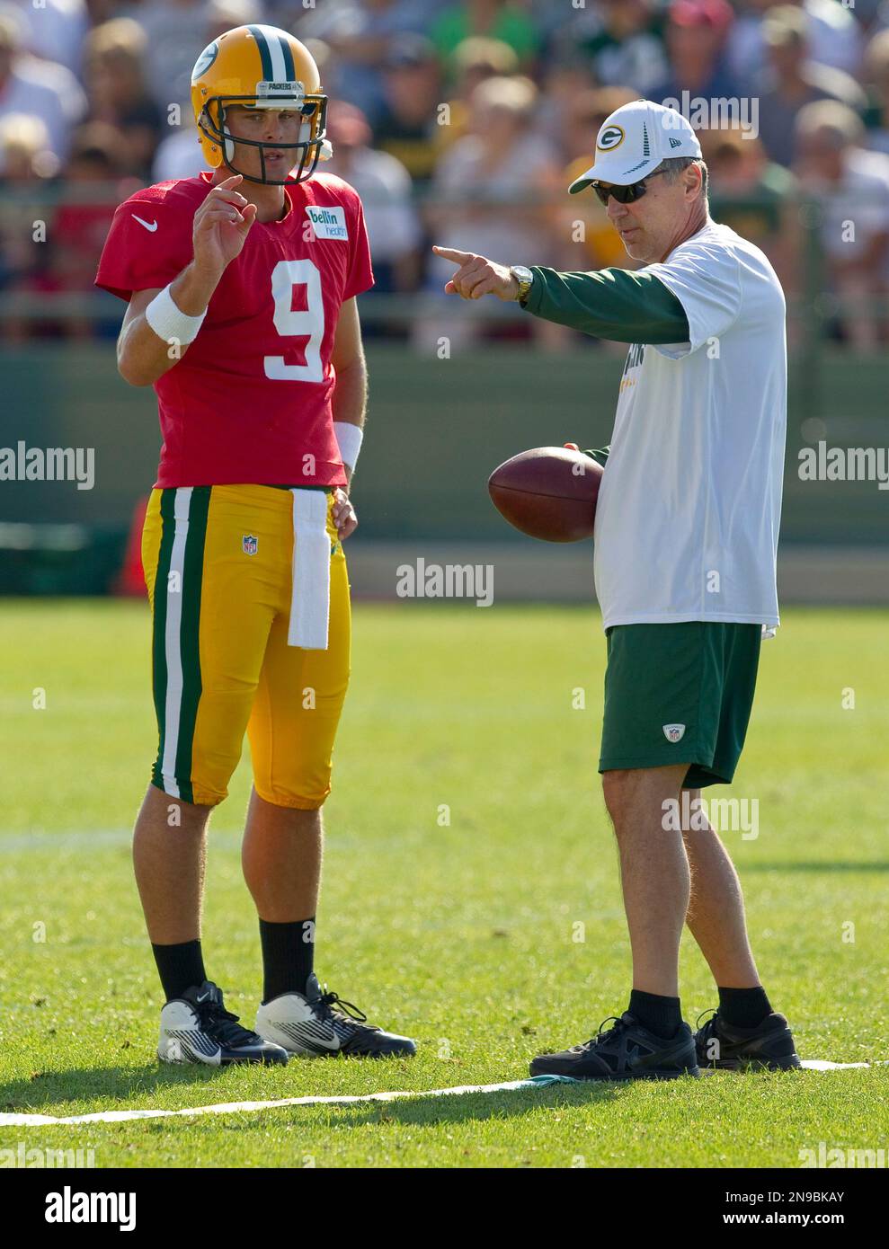 Green Bay Packers offensive coordinator Tom Clements,right, works with ...