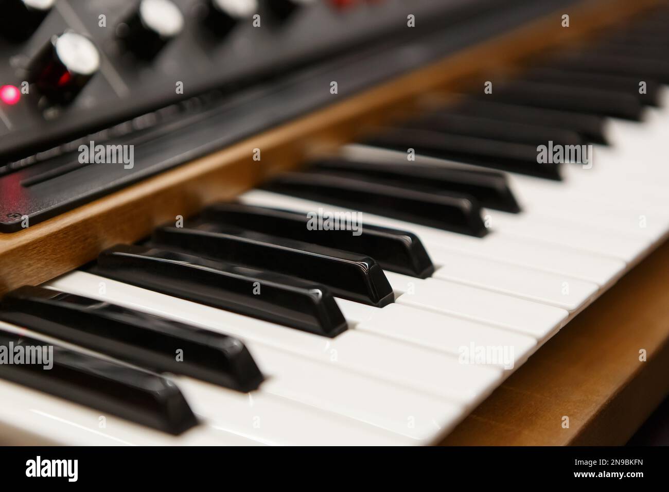 Black and white piano keys on modern synthesizer. Professional ...