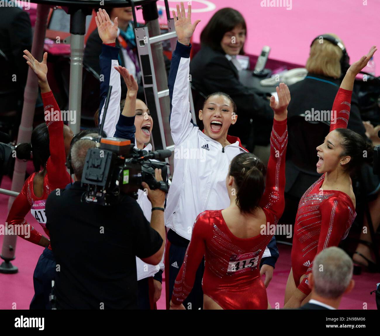 U.S. gymnasts celebrate after being declared winners of the Artistic ...