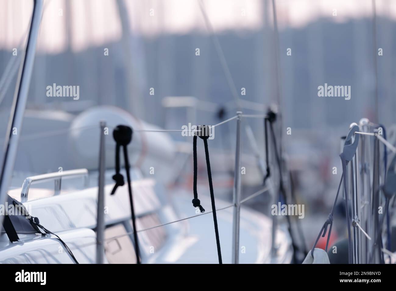 Nautical ropes on a deck. Winch and nautical ropes on a sailing boat ...