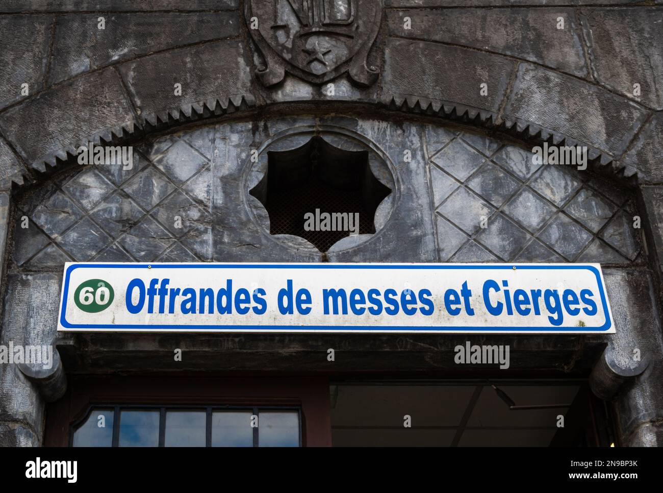 Lourdes, France - August 28, 2021: Mass and candle offerings - sign ...