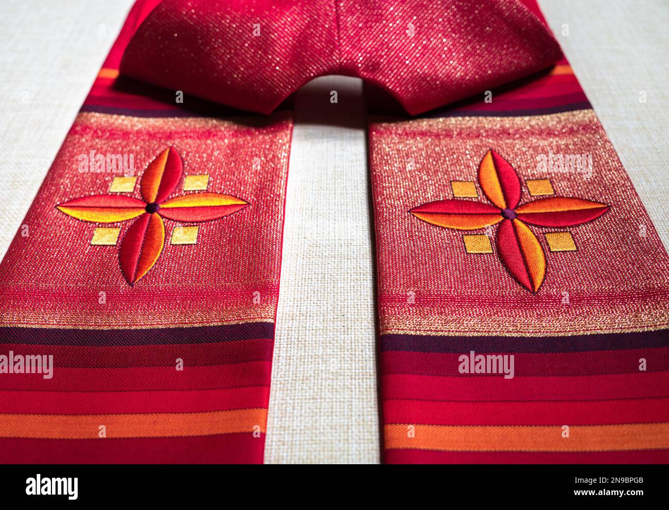 Red liturgical stole of a catholic priest with two crosses Stock Photo ...
