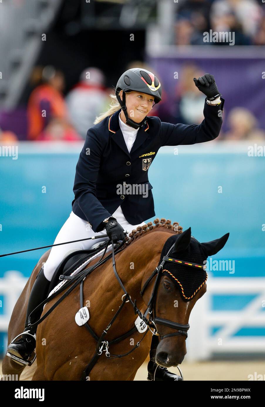 Sandra Auffarth riding Opgun Louvo celebrates her ride in the show ...