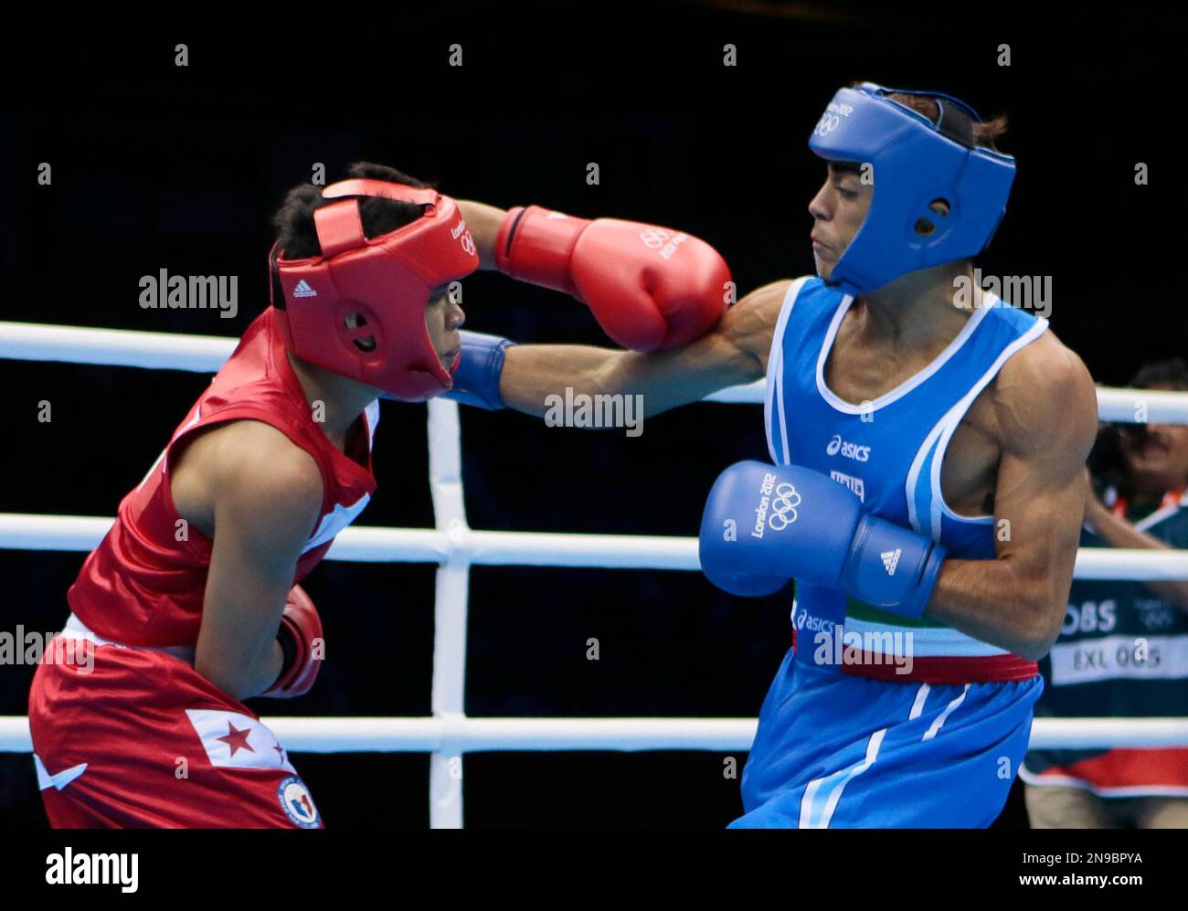 Philippines' Mark Barriga, left, fights Italy's Manuel Cappai during ...
