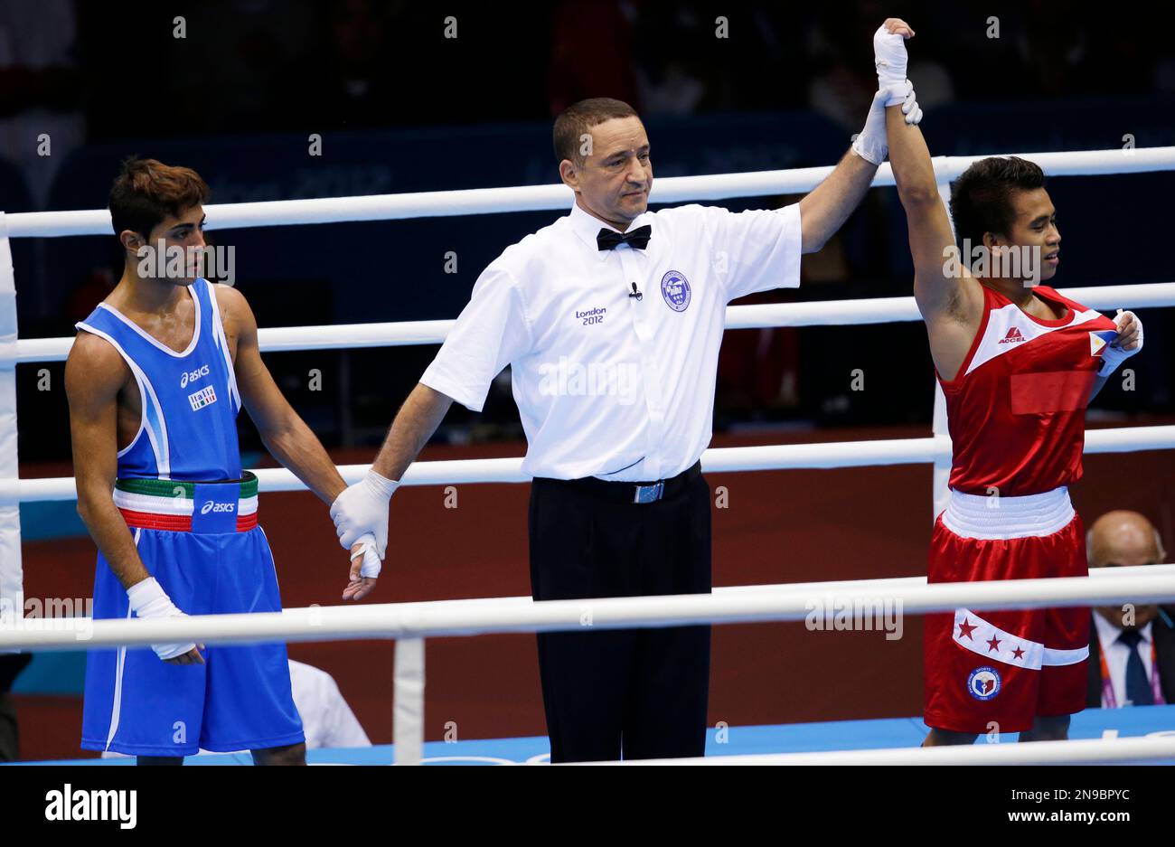 Philippines' Mark Barriga, right, reacts after defeating Italy's Manuel ...