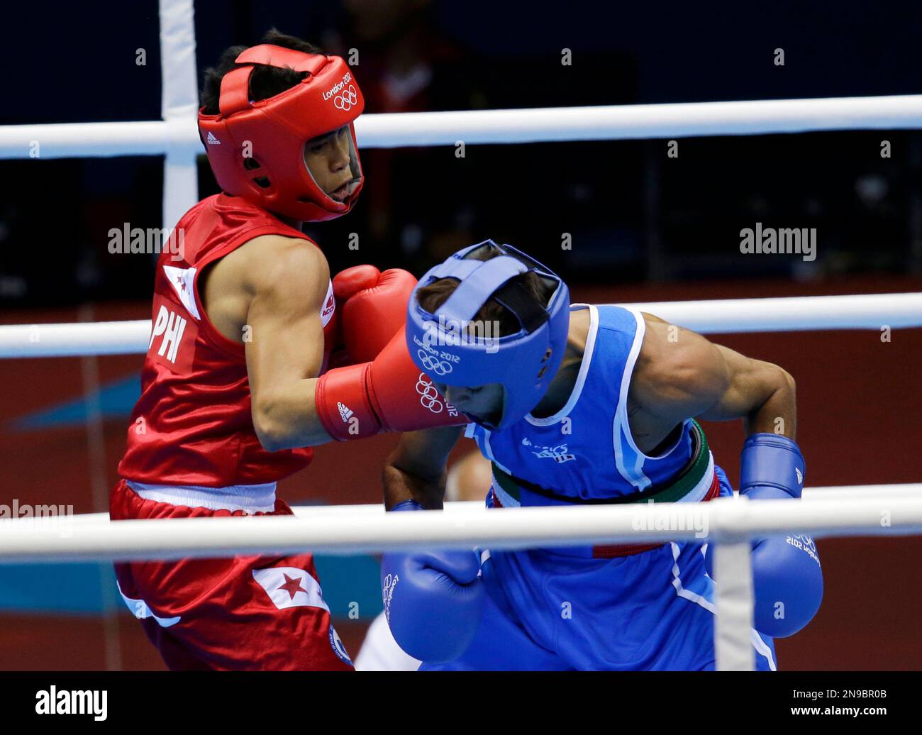Philippines' Mark Barriga, left, fights Italy's Manuel Cappai during a ...