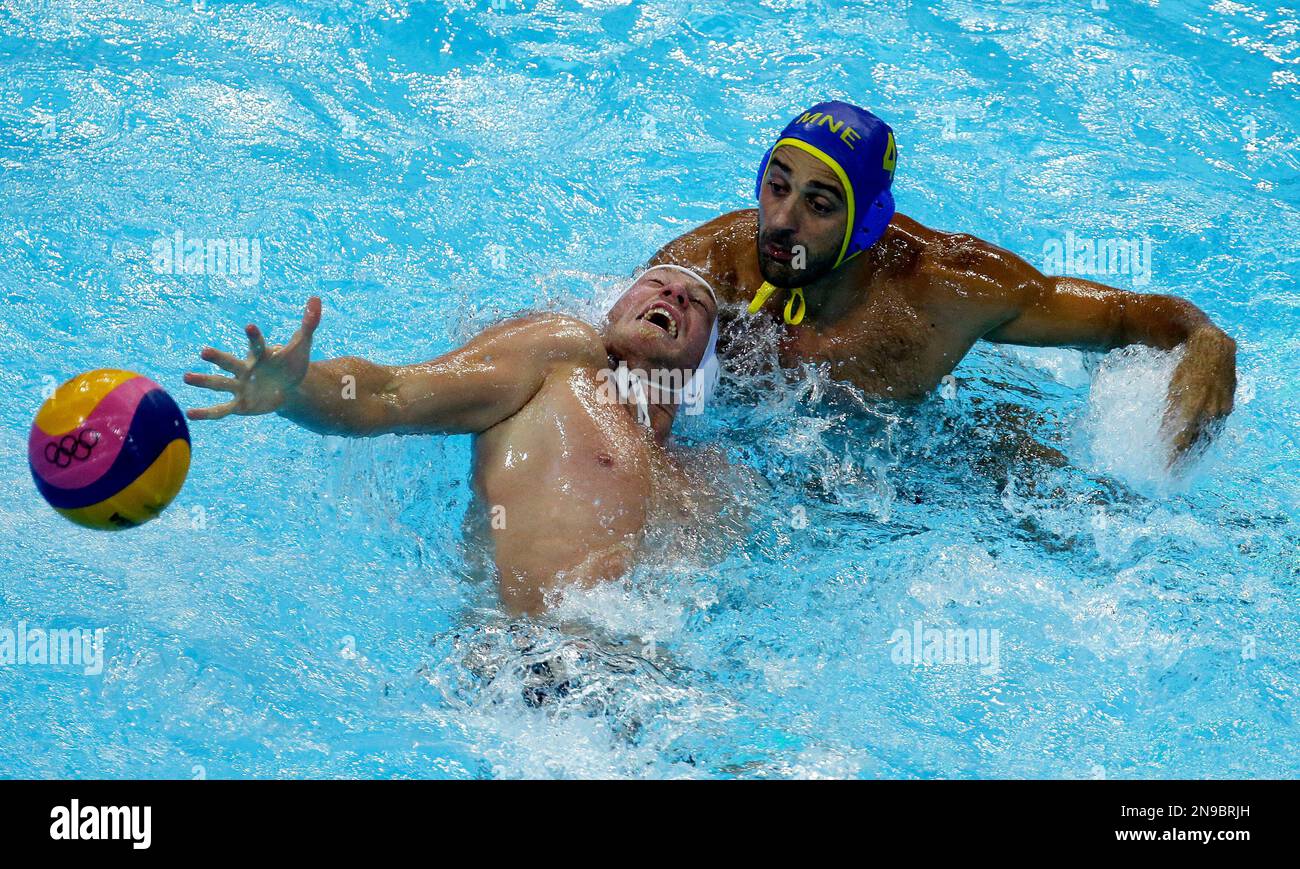 Adam Steinmetz, left, of Hungary is pulled down by Antonio Petrovic of ...
