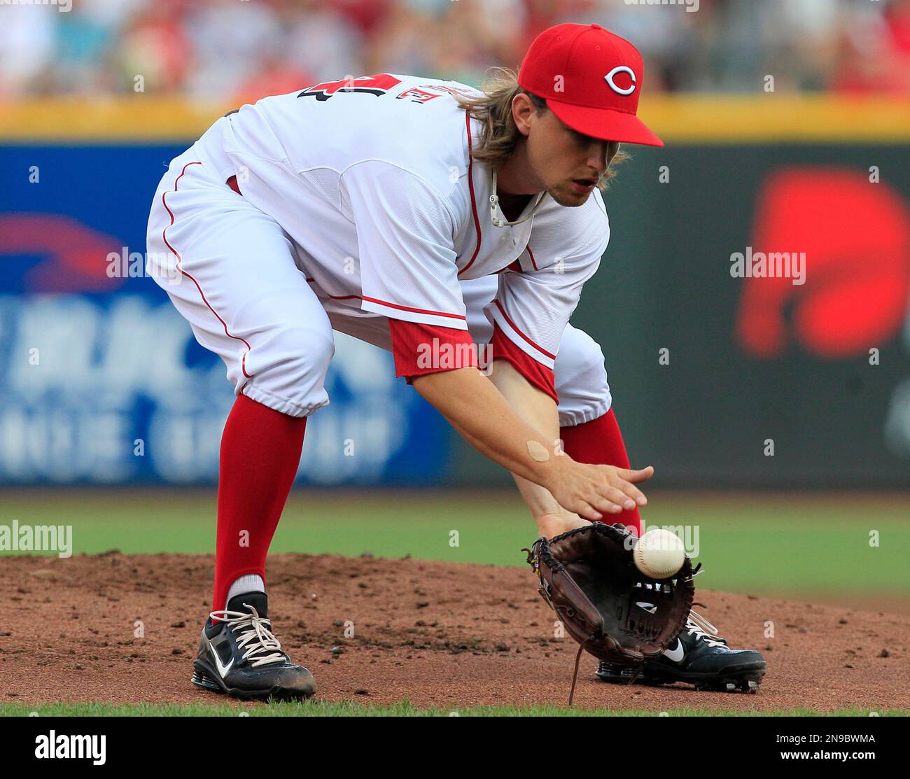 Cincinnati Reds starting pitcher Mike Leake fields a ground ball hit by ...