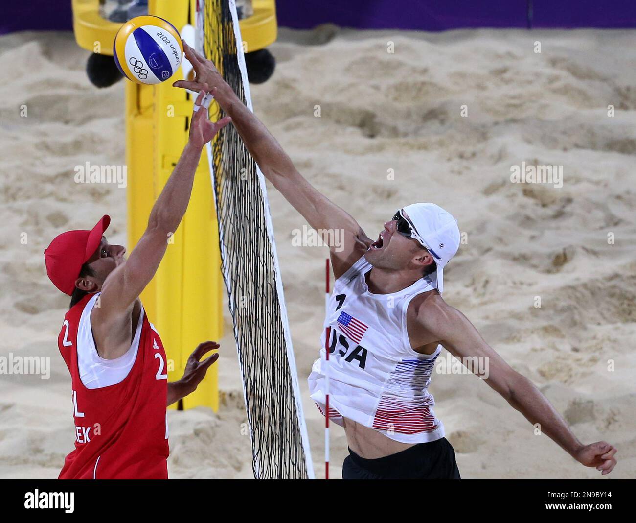 Grzegorz Fijalek, left, from Poland tries to block Jake Gibb, right, of ...