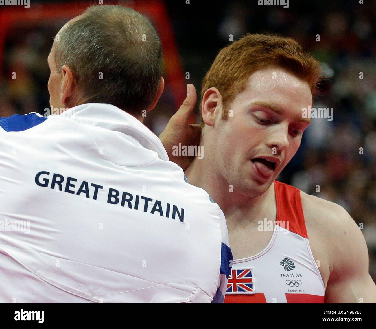 Great Britain's gymnast Daniel Purvis is acknowledged by a team ...