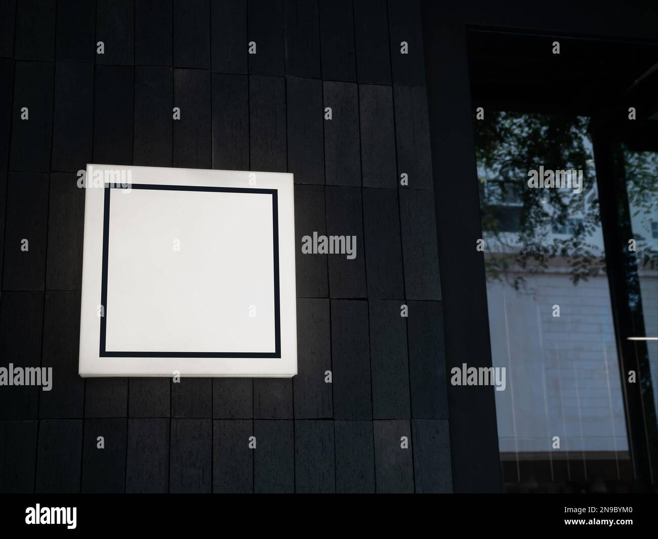 Square frame on mockup of light box signage in front of coffee shop ...