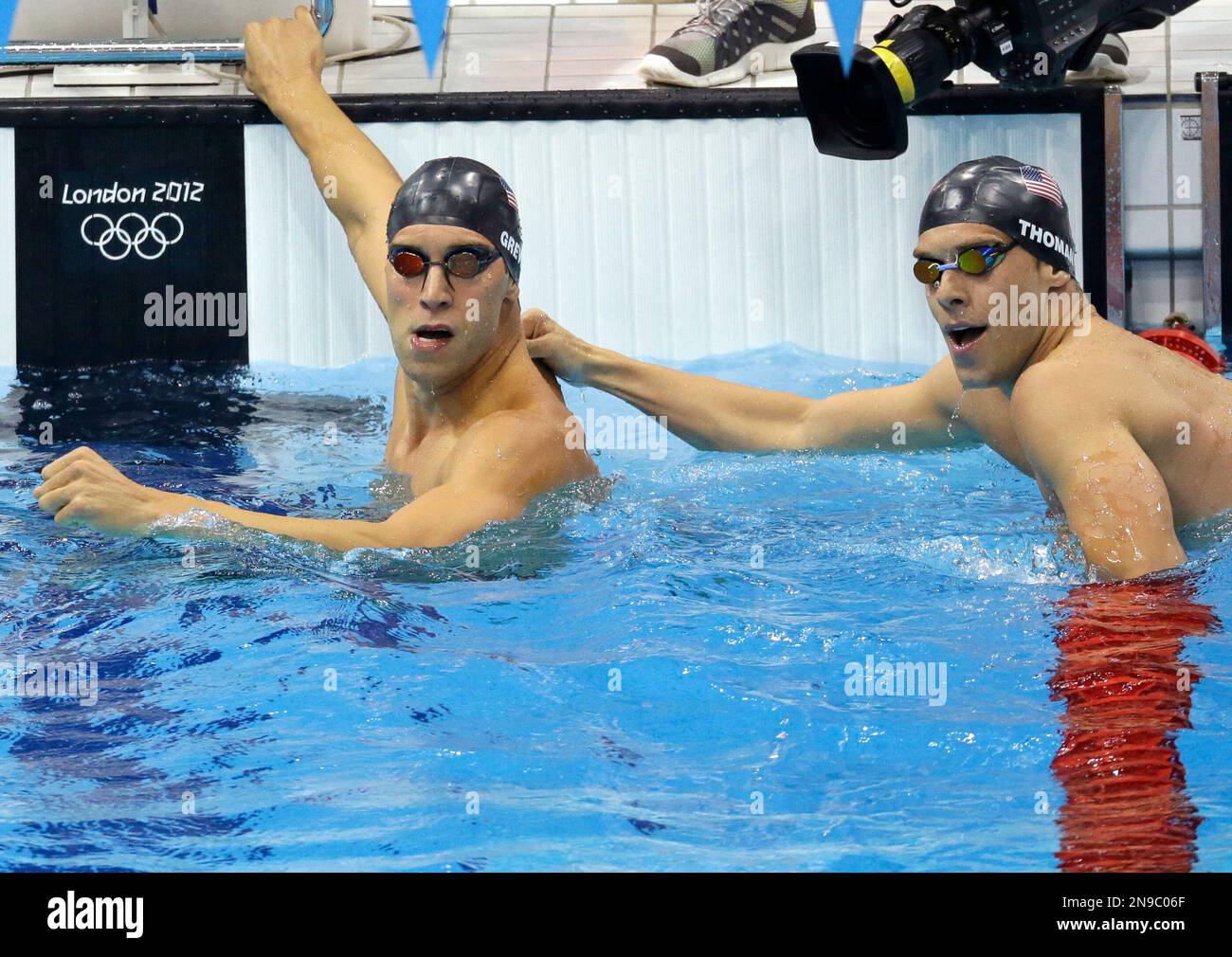 United States gold medalist Matthew Grevers, left, celebrates with ...