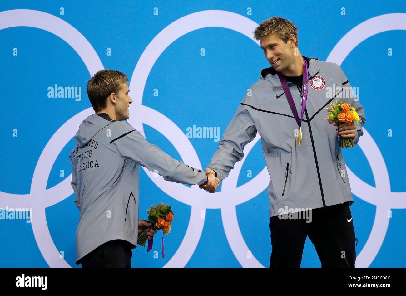 United States silver medalist Nick Thoman, left, shakes hands with gold ...