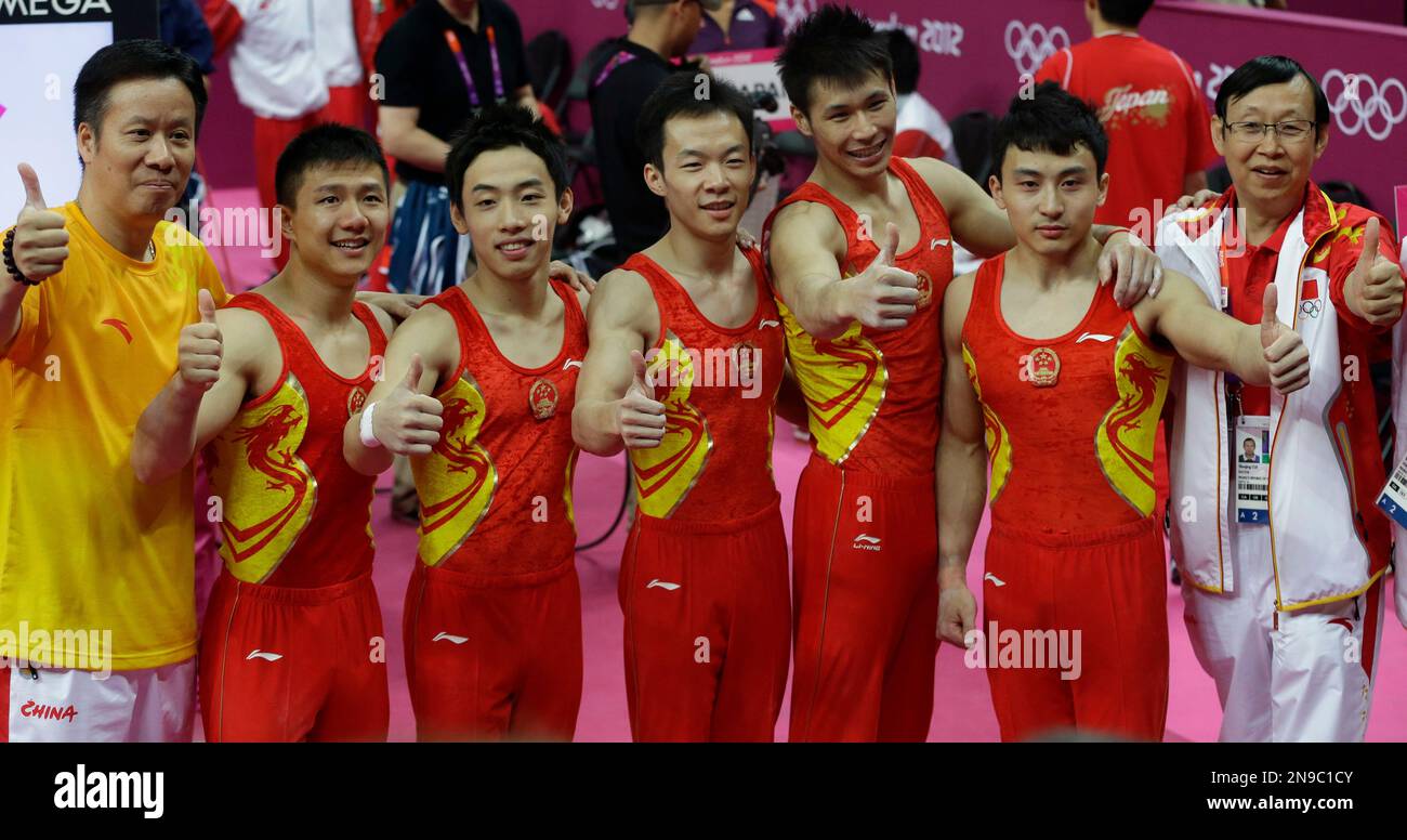 The Chinese team celebrates their gold medal in the Artistic Gymnastic ...