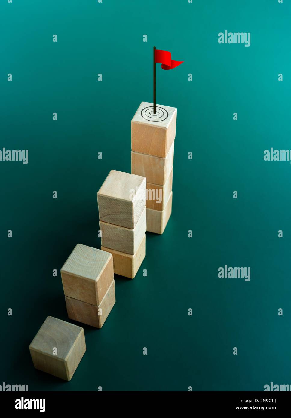 Red flag, the goal, target symbol on the top of wooden cube blocks, bar ...