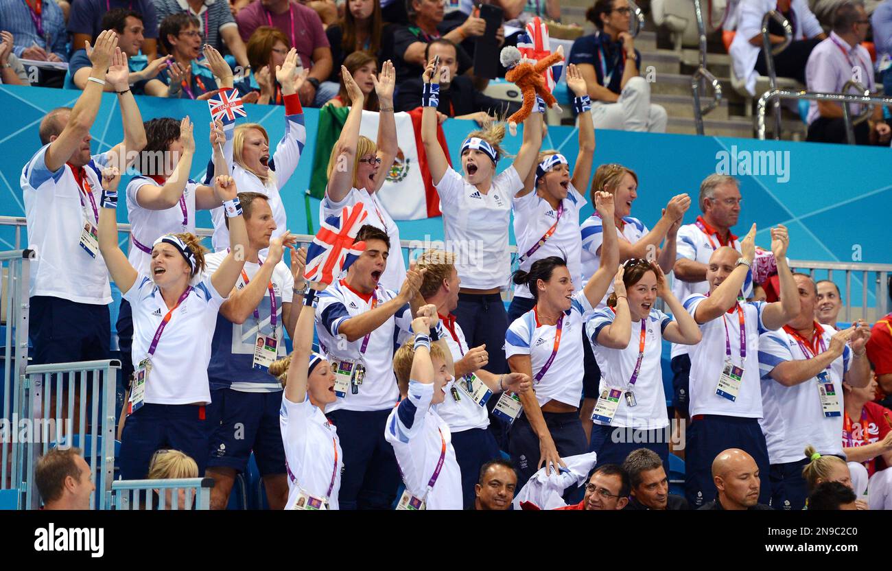 Members of Great Britain's diving team cheer during competition in the ...