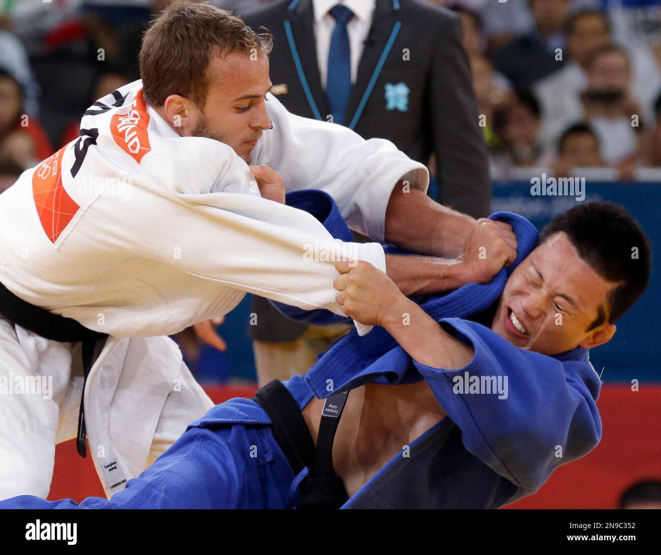 Ugo Legrand of France, left, competes against Wang Ki-Chun of South ...