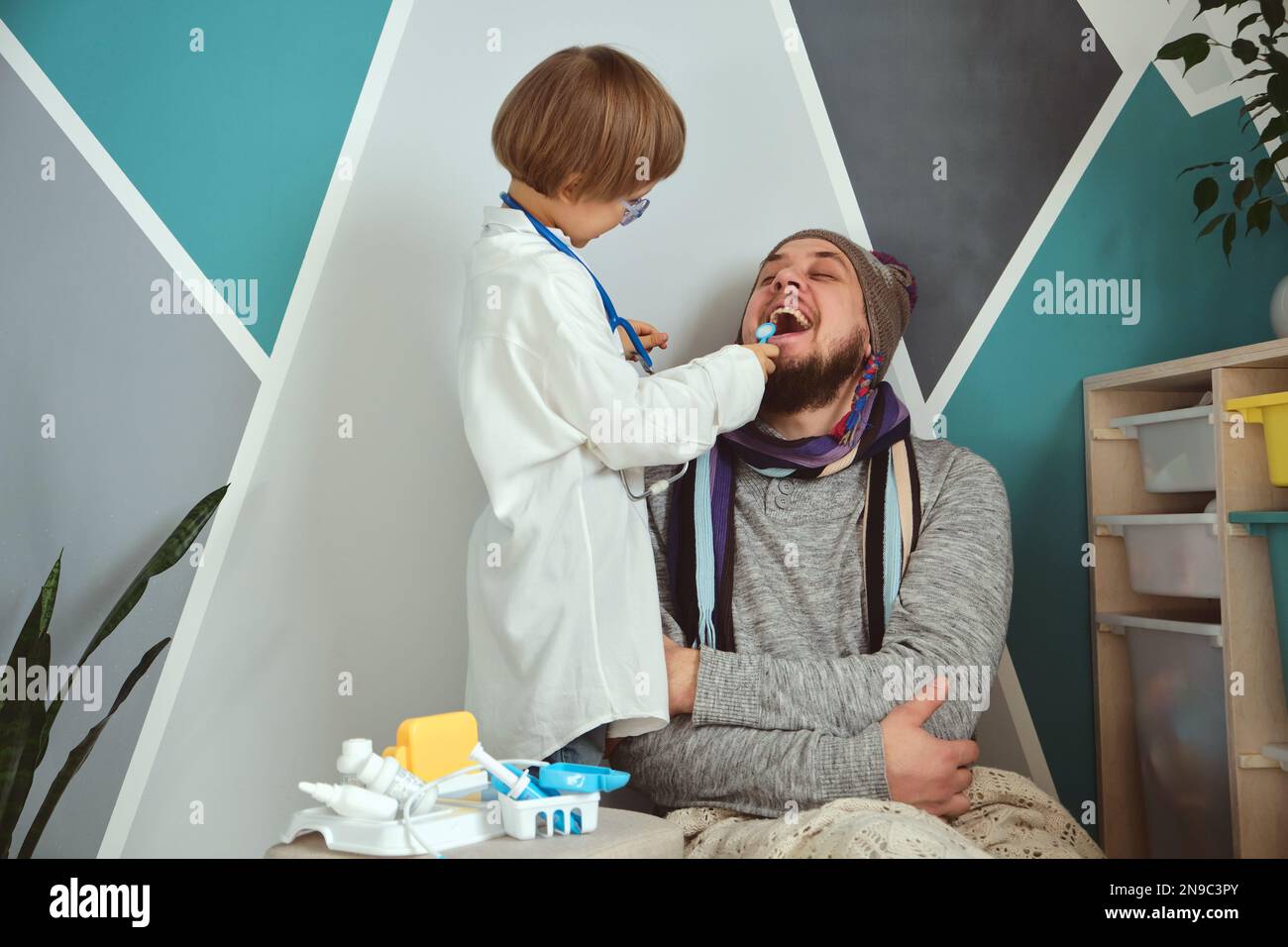 Father and child playing clinic and doctor, little boy dentist in ...