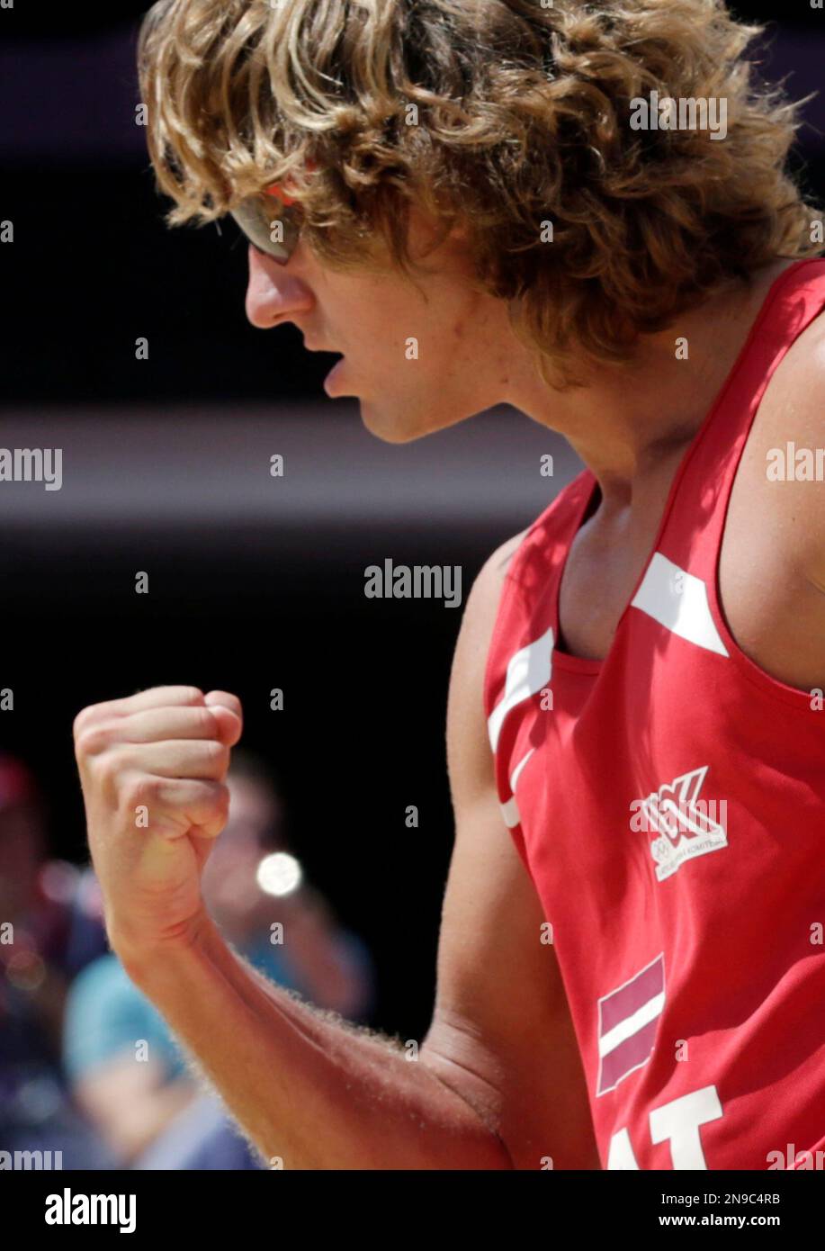 Aleksandrs Samoilovs of Latvia reacts during a beach volleyball match ...