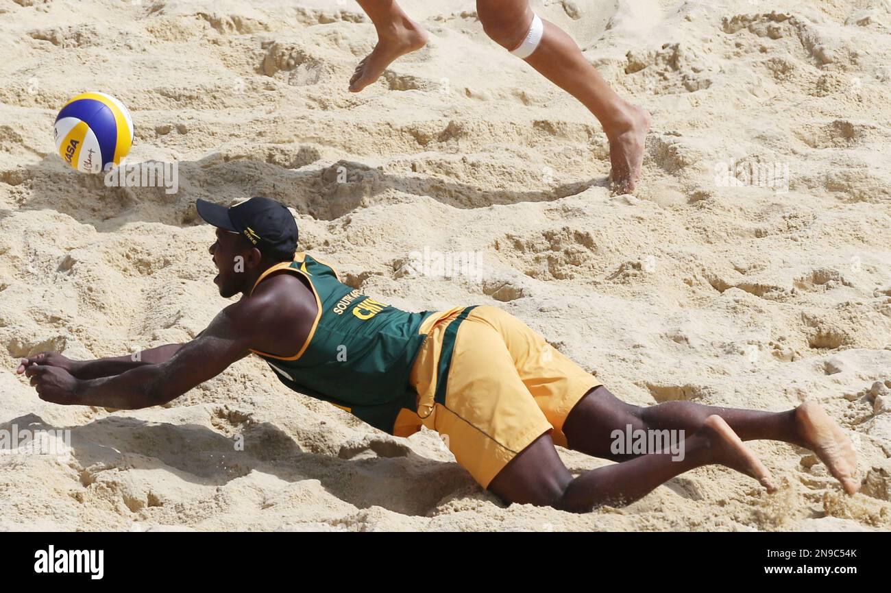 Freedom Chiya from South Africa dives for a ball during the Beach ...
