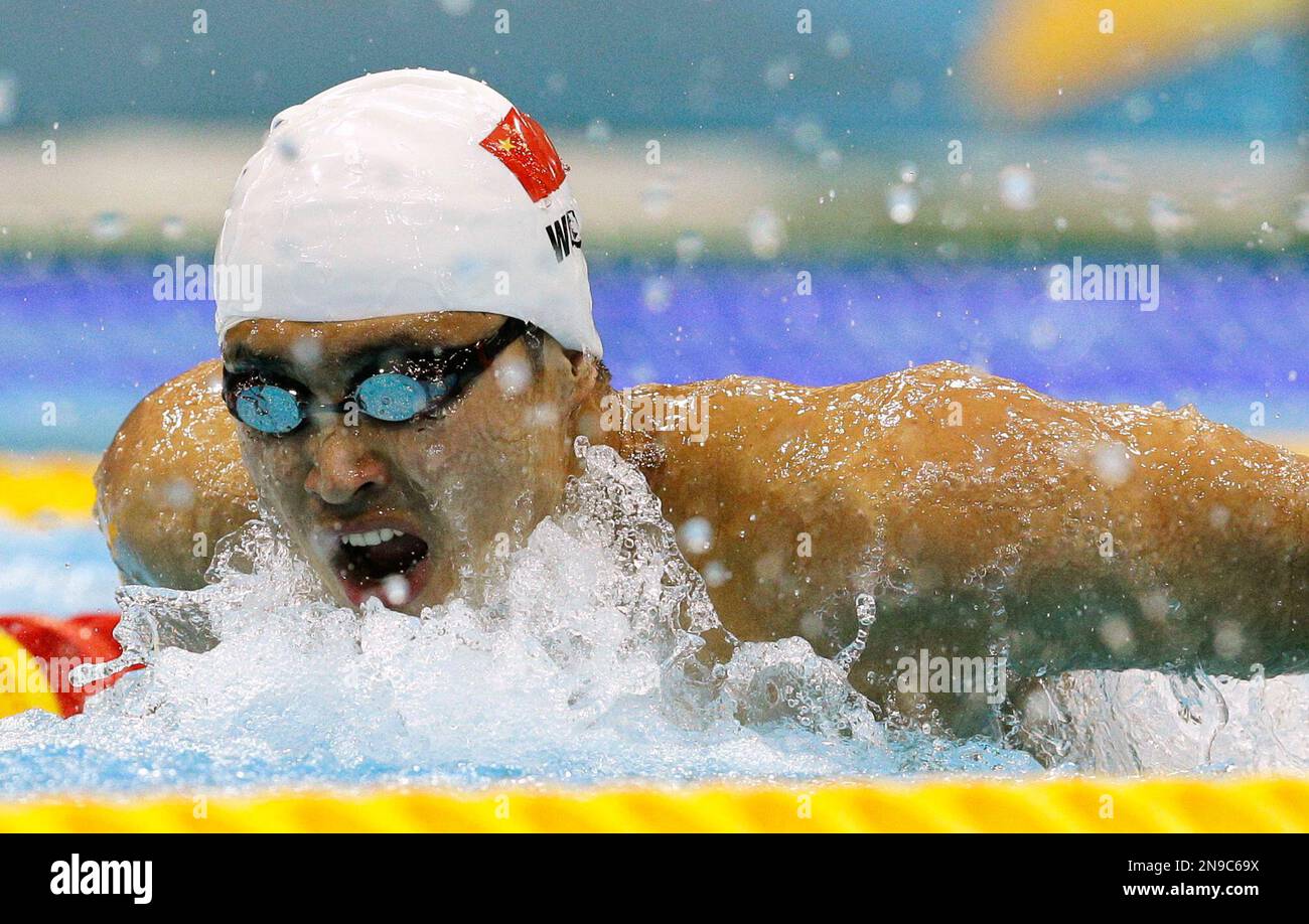 China's Wu Peng competes in a men's 200-meter butterfly swimming heat ...