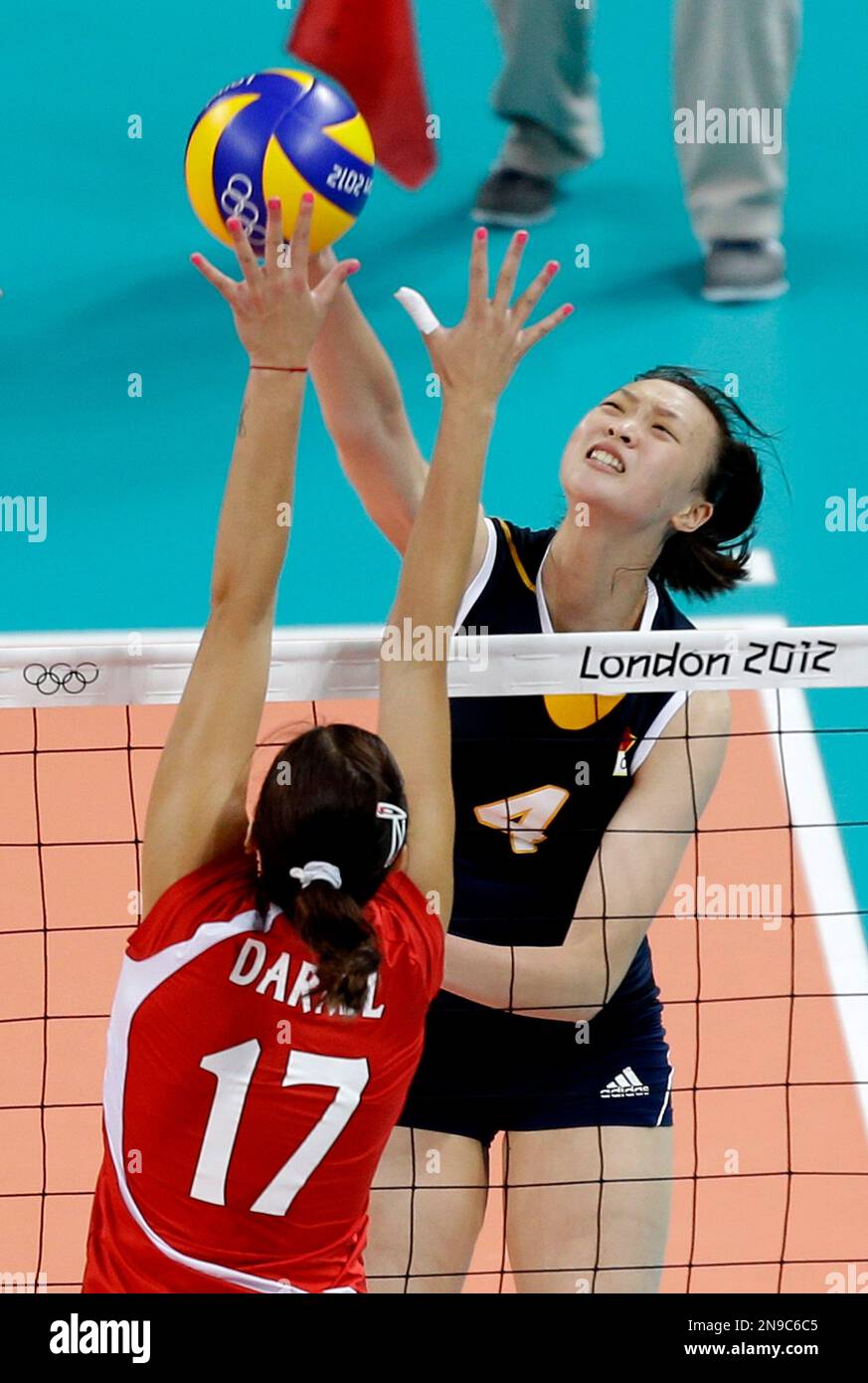 China's Hui Ruoqi (4) spikes the ball over Turkey's Neslihan Darnel (17 ...