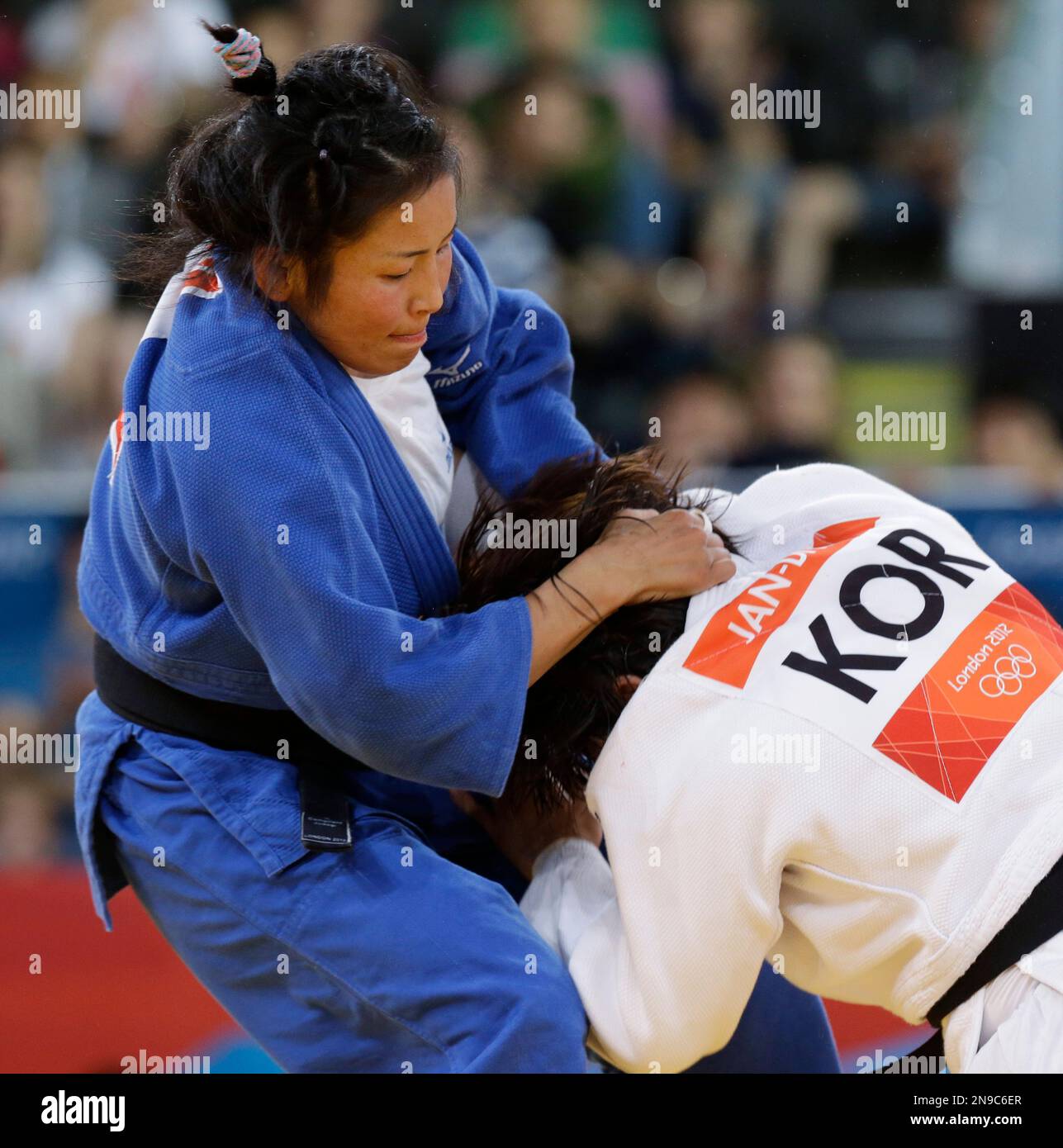 Jan Di Kim of South Korea, right, competes with Sumiya Dorjsuren of ...
