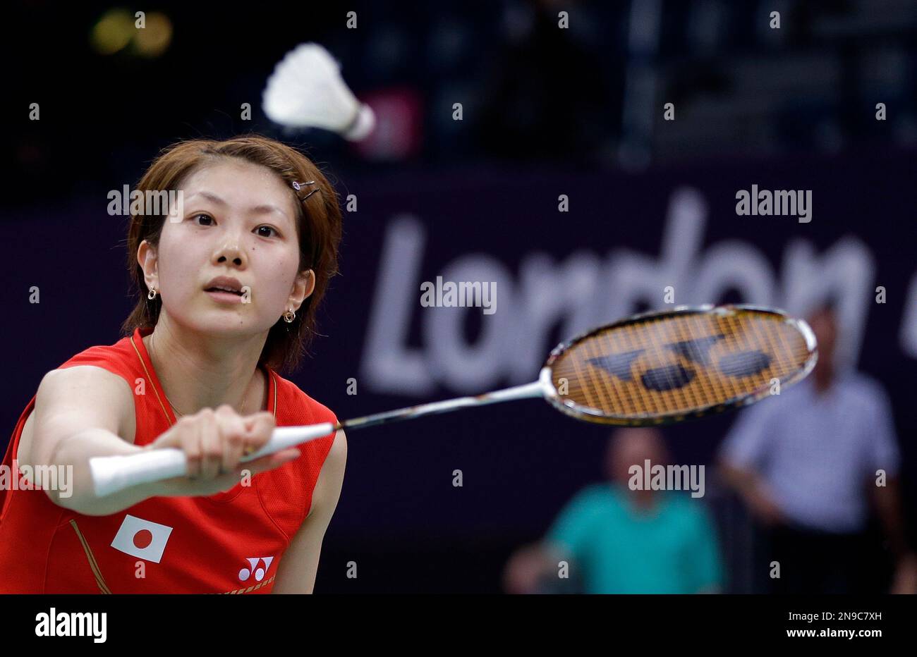 Japan's Reiko Shiota returns the shuttlecock while playing with ...