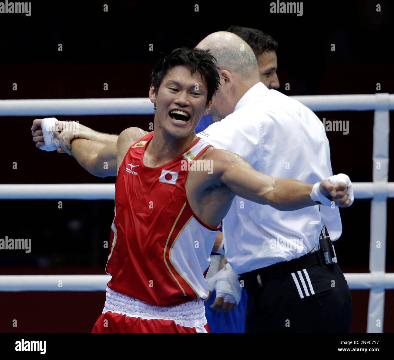 Japan's Suzuki Yasuhiro reacts after defeating Morocco's Mehdi Khalsi ...