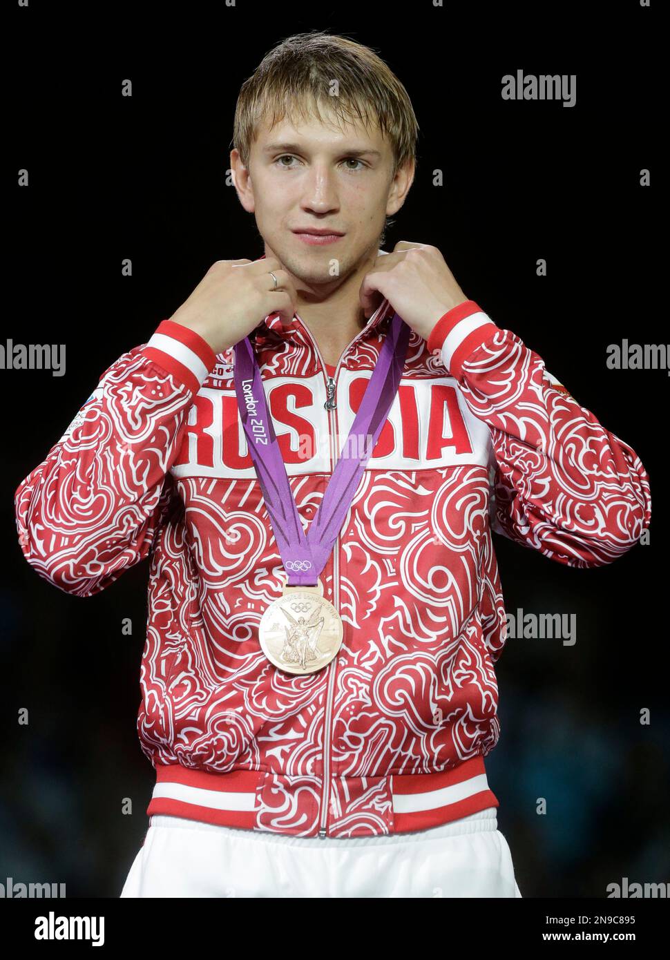 Russia's Nikolay Kovalev stands on the medal stand after winning the bronze medal match against ...