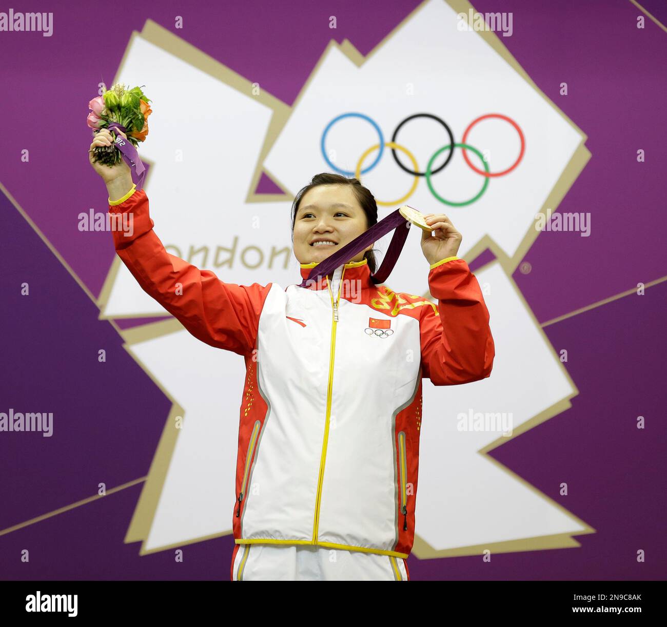 China's Guo Wenjun celebrates after winning the gold medal in the women ...