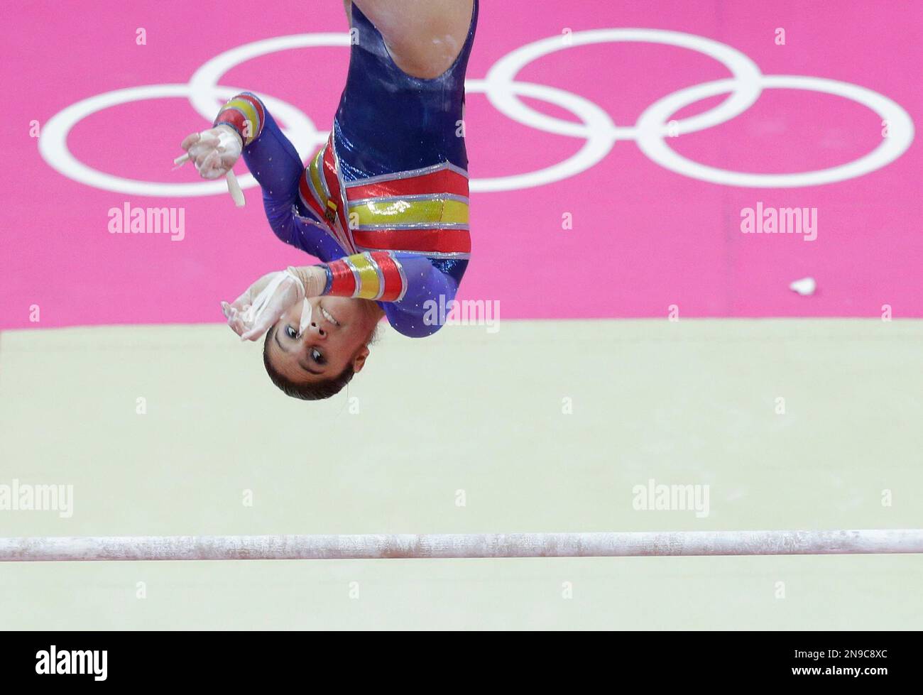 Spanish gymnast Ana Maria Izurieta performs on the uneven bars during ...
