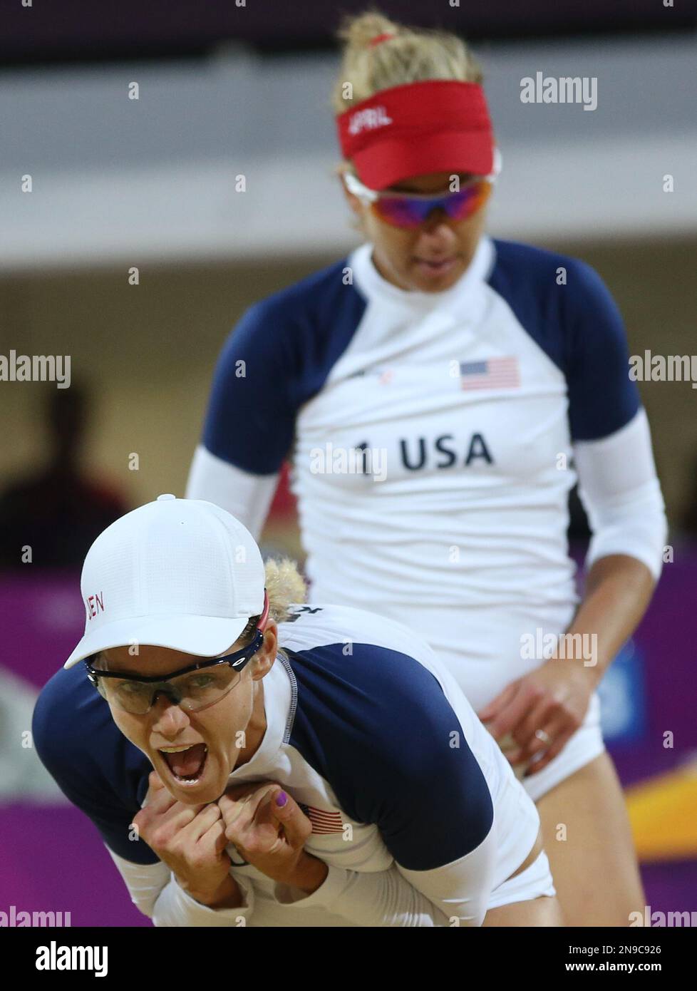 April Ross, right, of US celebrates with her teammate Jennifer Kessy ...