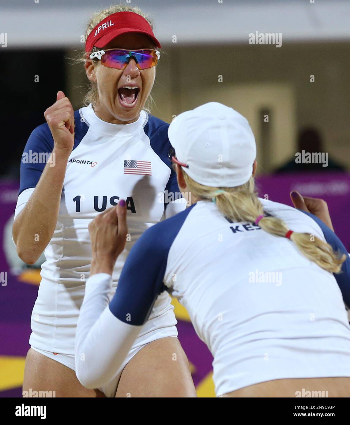 April Ross, left, of US celebrates with her teammate Jennifer Kessy ...