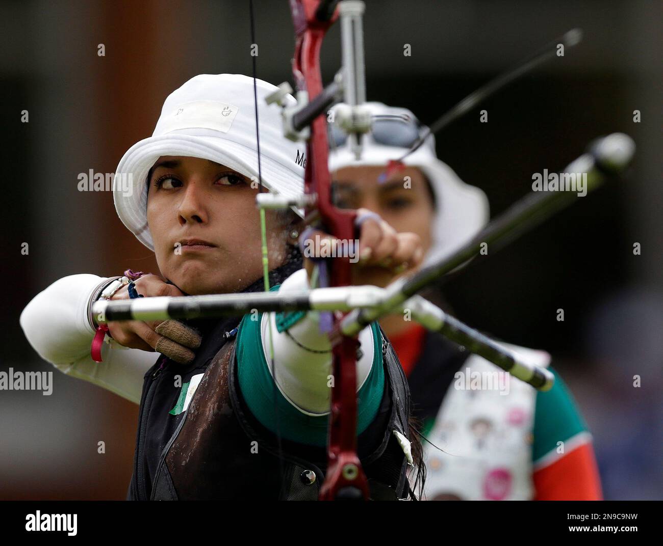 Mexico's Mariana Avitia shoots during the women's archery team ...