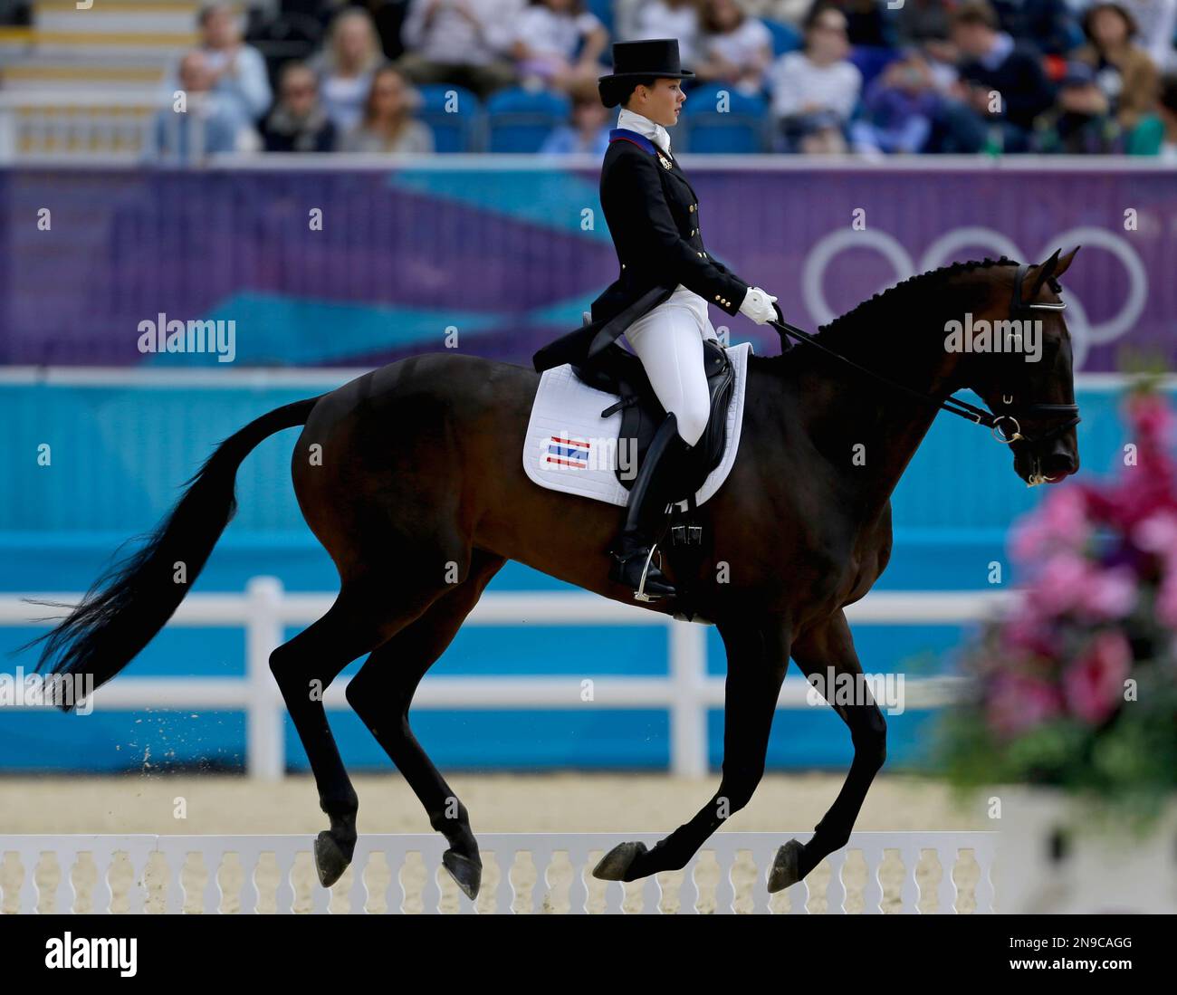Nina Lamsan Ligon, of Thailand, and her horse Butts Leon, compete in ...