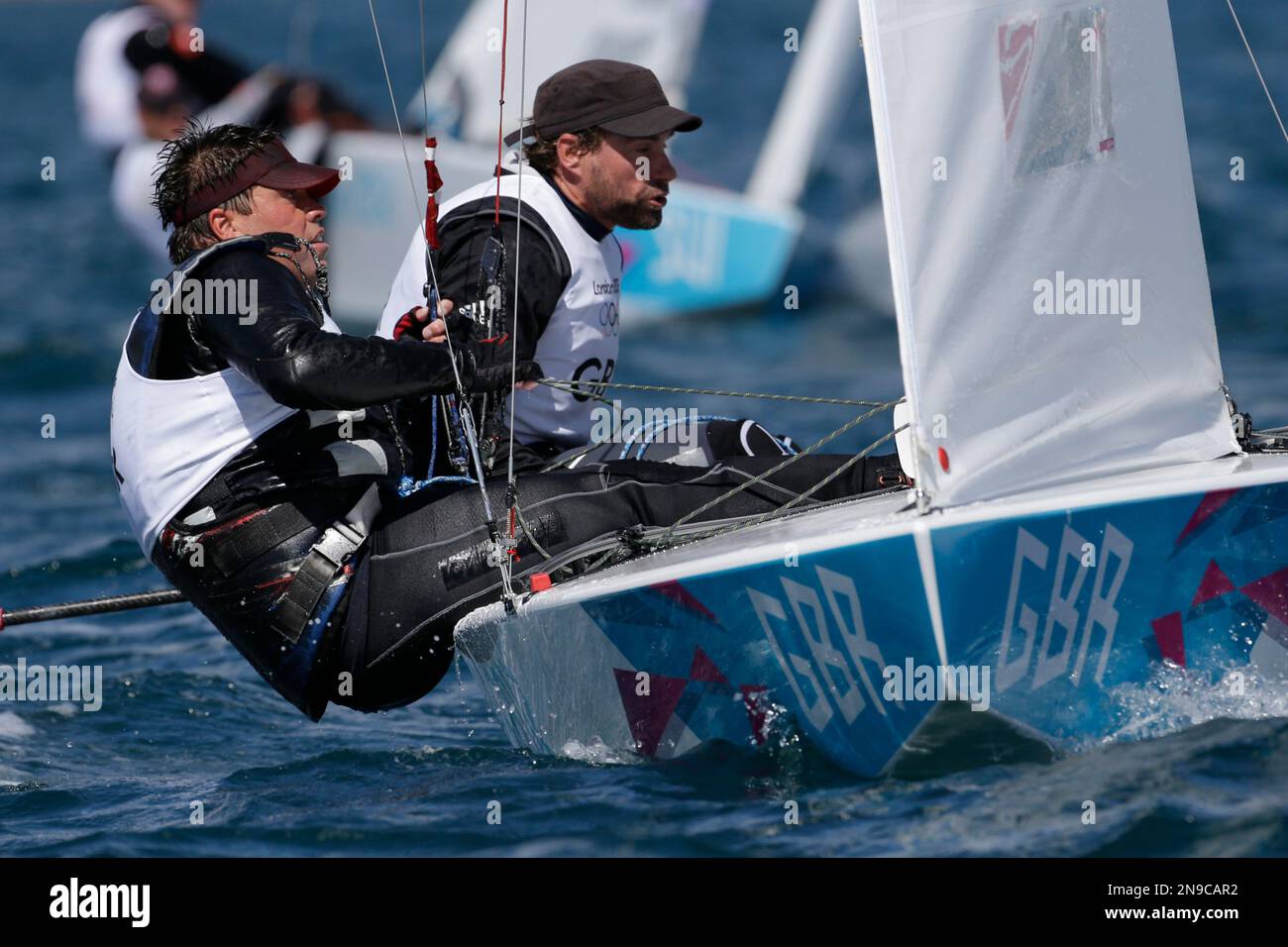 Crew Iain Percy, background, and Andrew Simpson, from Great Britain ...