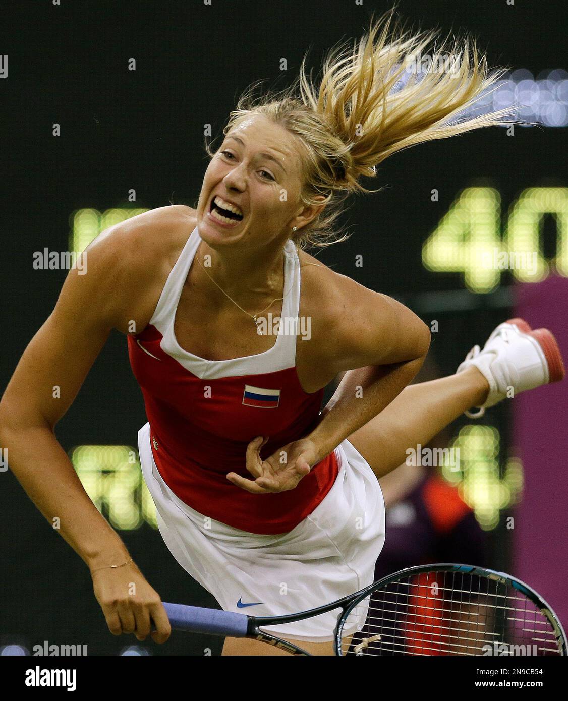 Maria Sharapova of Russia serves to Shahar Peer of Israel at the All ...